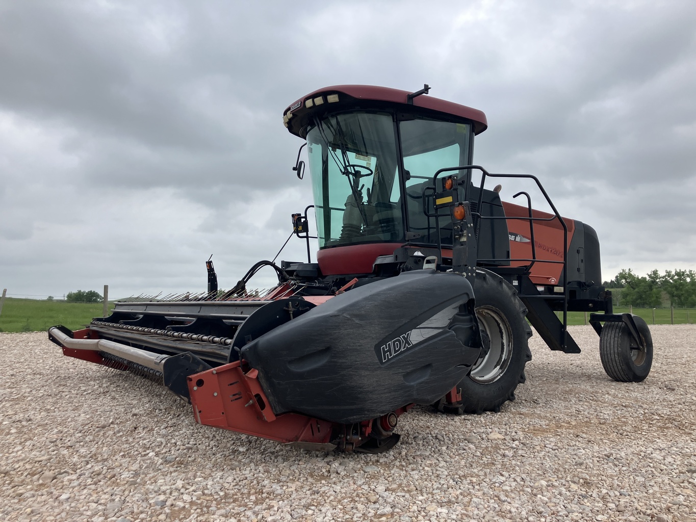 Lot 4450 - '05 CIH WDX1202 WINDROWER w/16' HS SICKLE HEAD. Onsite-Belle ...